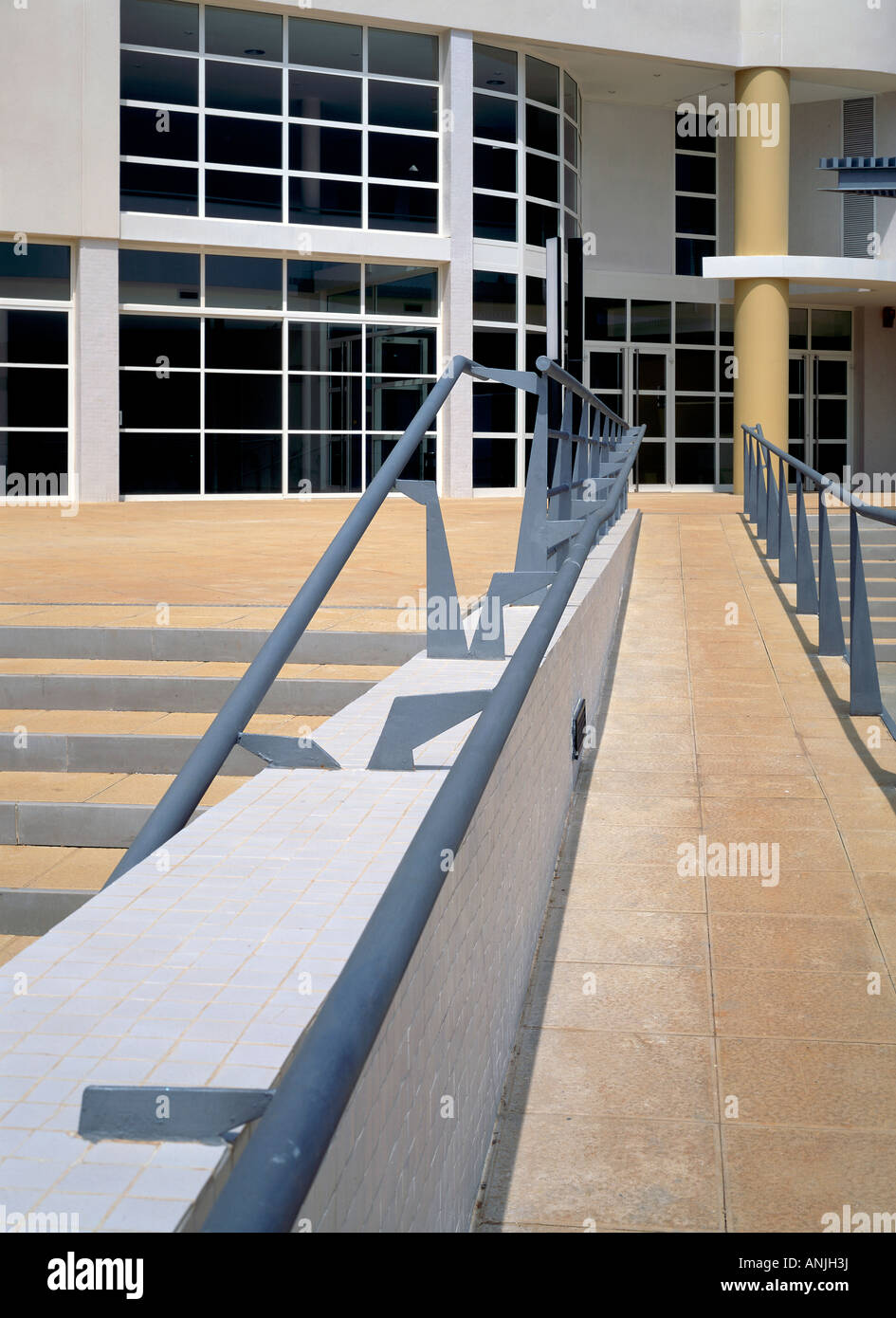 View of a passageway leading to an office building Stock Photo - Alamy