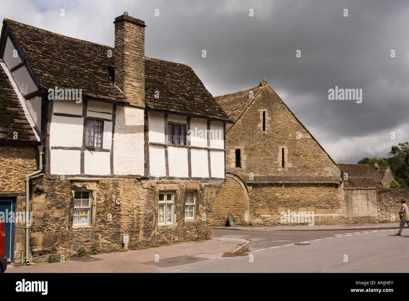 UK Wiltshire Lacock village High Street medieval Tithe Barn at East ...