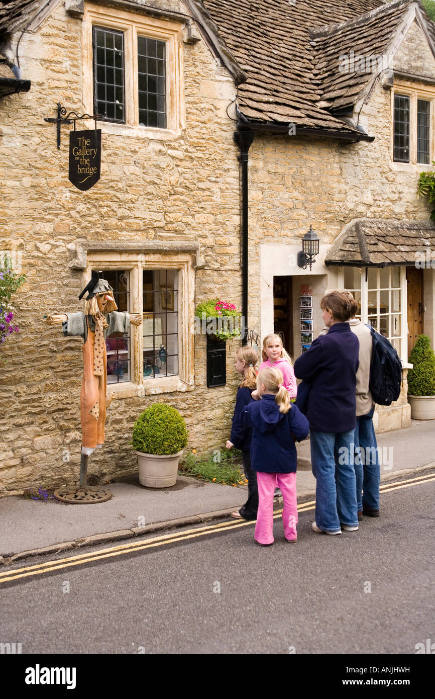 UK Wiltshire Castle Combe High Street visitors outside the village ...