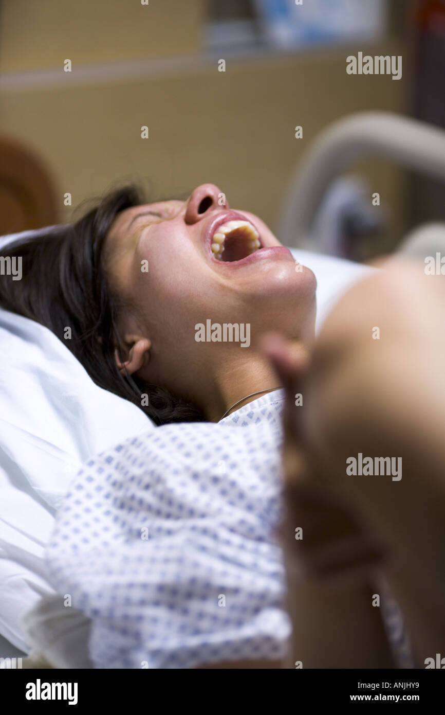 High angle view of a female patient showing uncomfortable expression ...