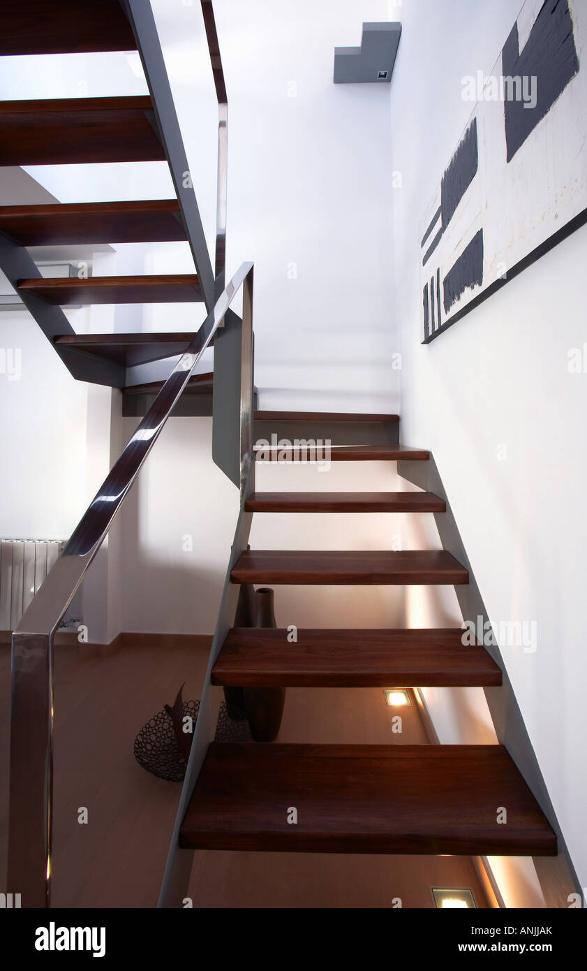 Modern style staircase with steel hand rail and wooden steps Stock ...