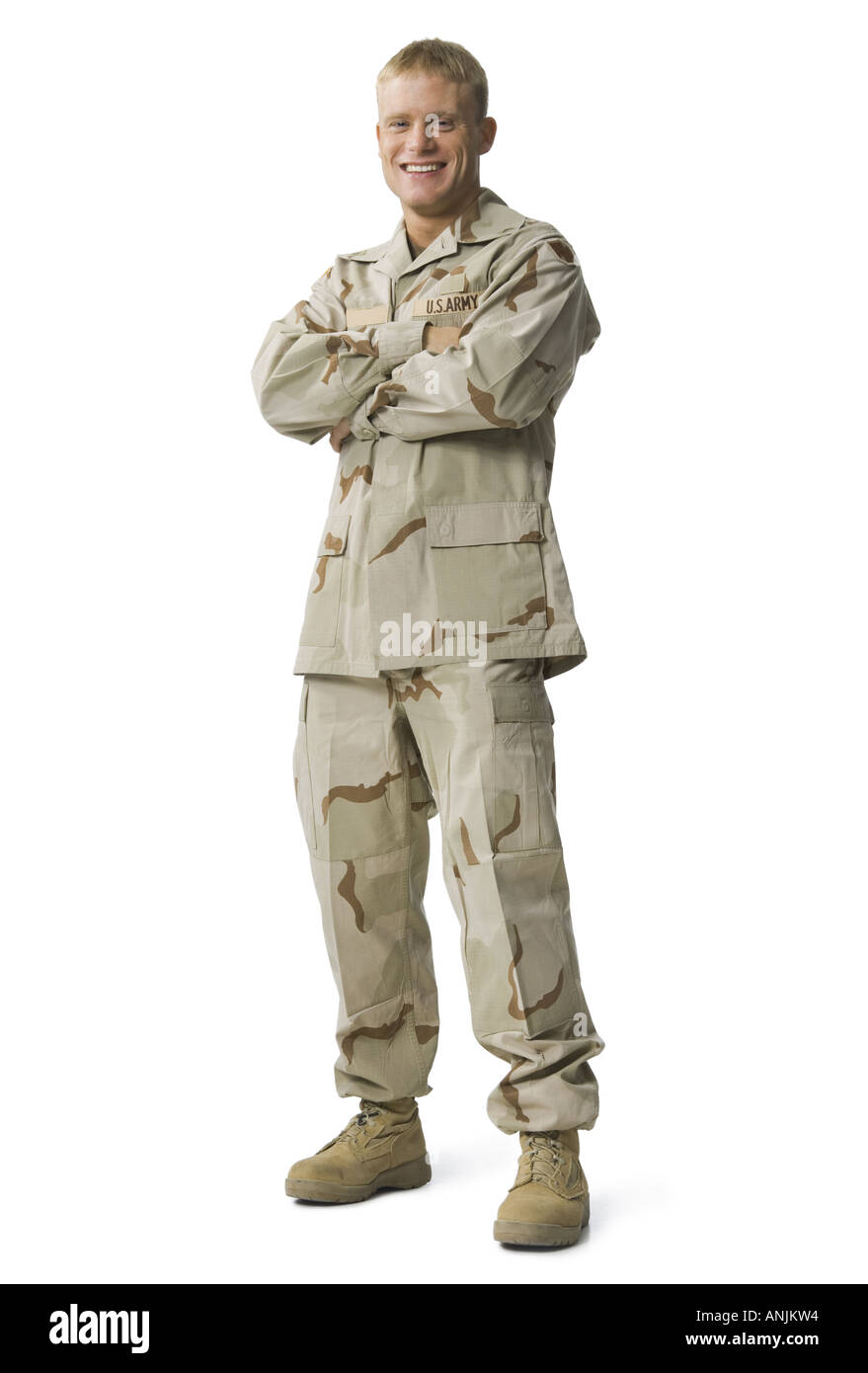 Portrait of a soldier standing with his arms folded Stock Photo - Alamy