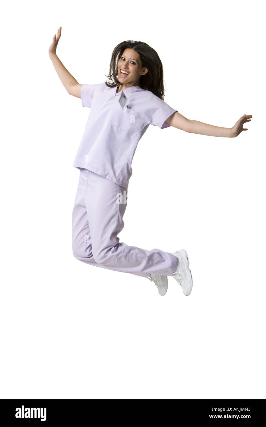 Portrait of a female nurse jumping Stock Photo - Alamy