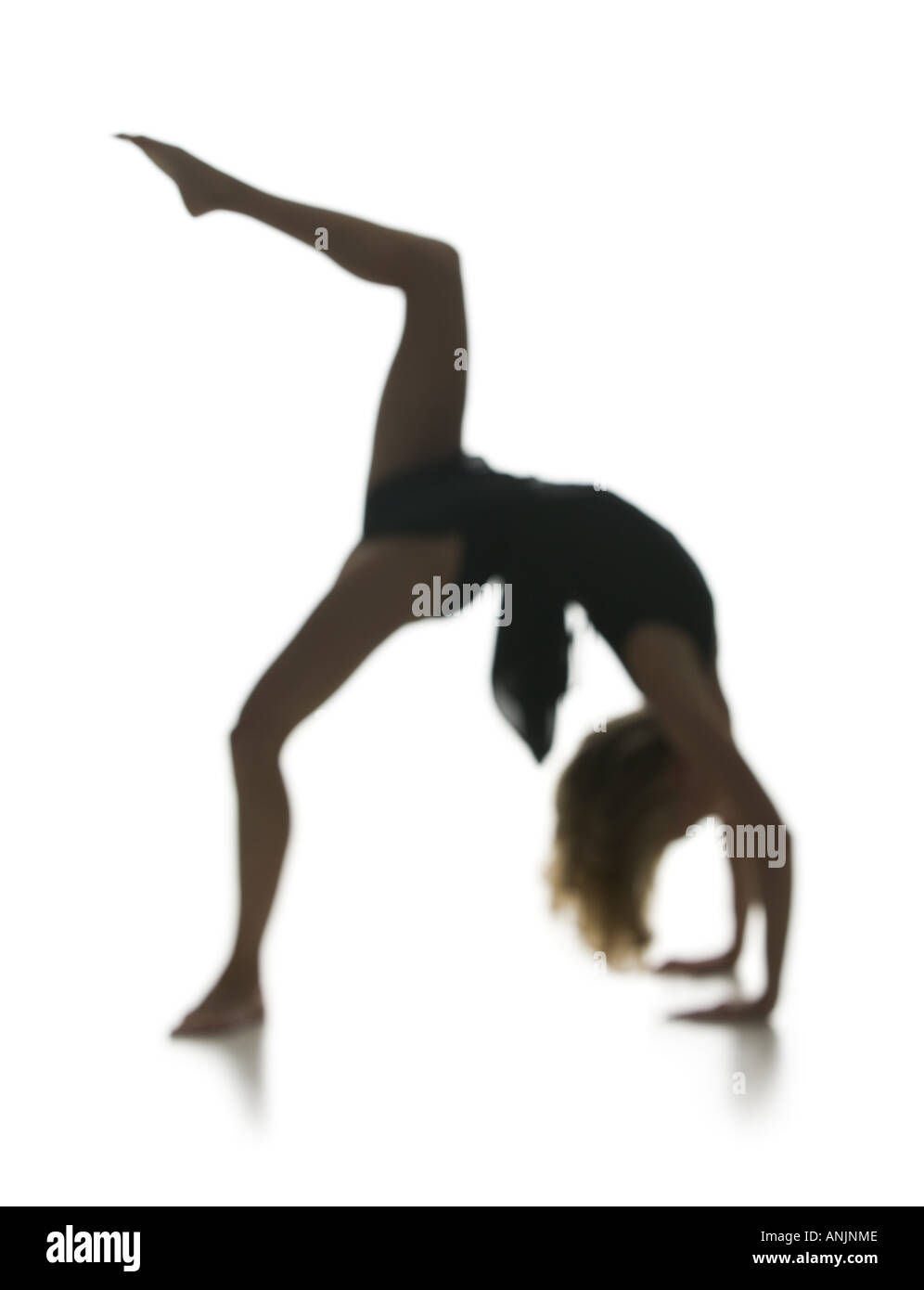 Side profile of a young woman bending over backwards Stock Photo - Alamy