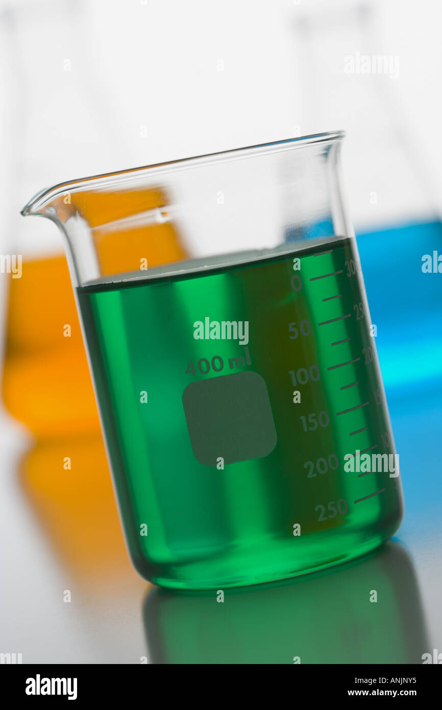 Close up of a measuring beaker with green liquid Stock Photo - Alamy