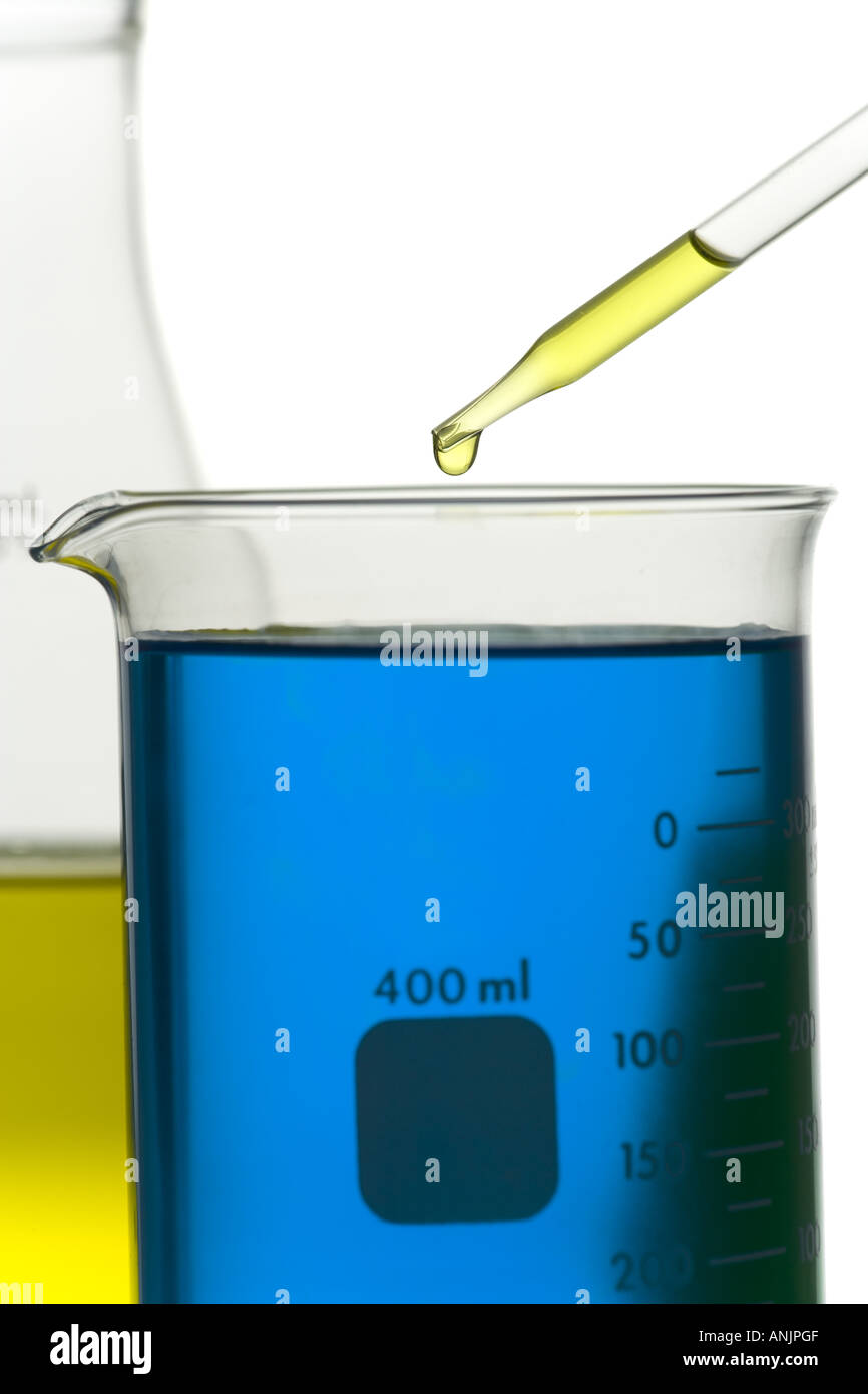Liquid being dropped into a beaker with a pipette Stock Photo - Alamy