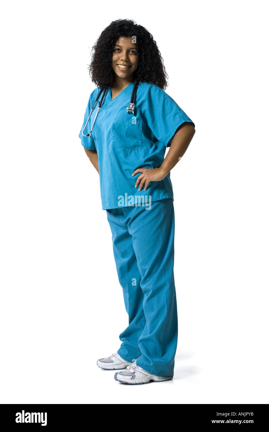 Portrait of a female nurse standing with arms akimbo Stock Photo - Alamy