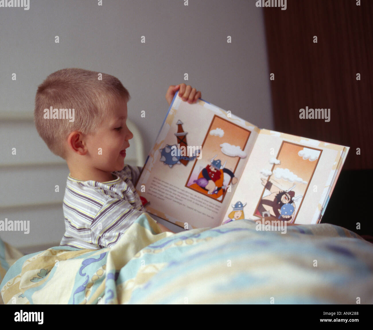 Watching a picture book Stock Photo - Alamy