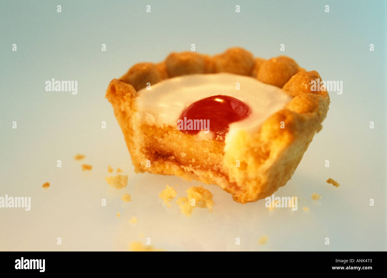 Cake with a bite taken Stock Photo - Alamy