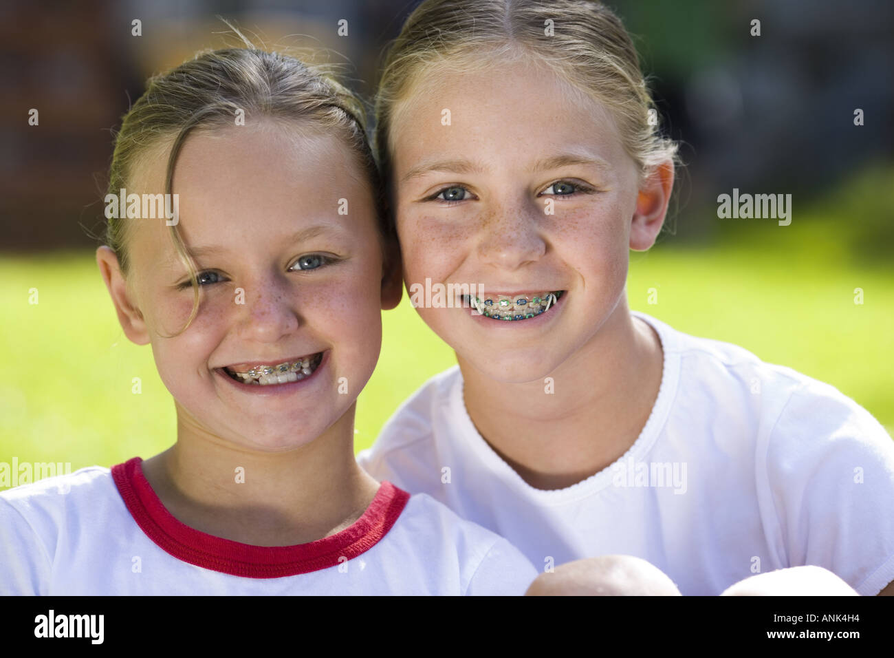 Portrait of two girls smiling Stock Photo - Alamy