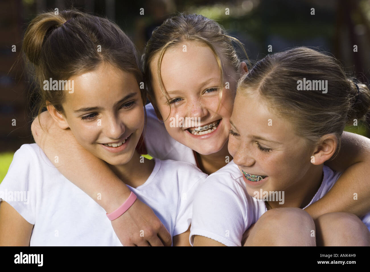 Close up of three girls smiling Stock Photo - Alamy