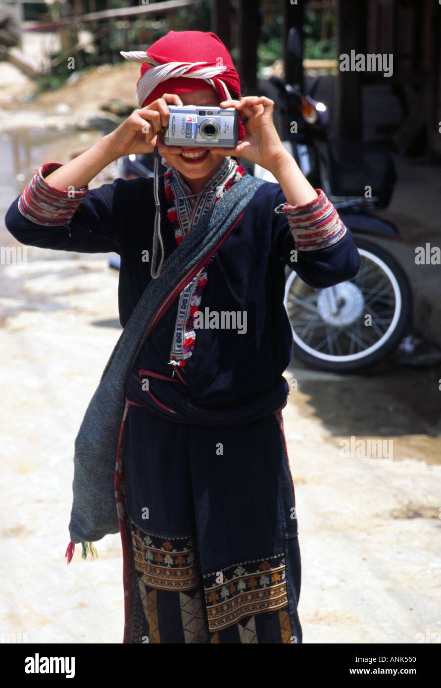 Red Hmong girl taking a photo SaPa Northern Vietnam Stock Photo - Alamy