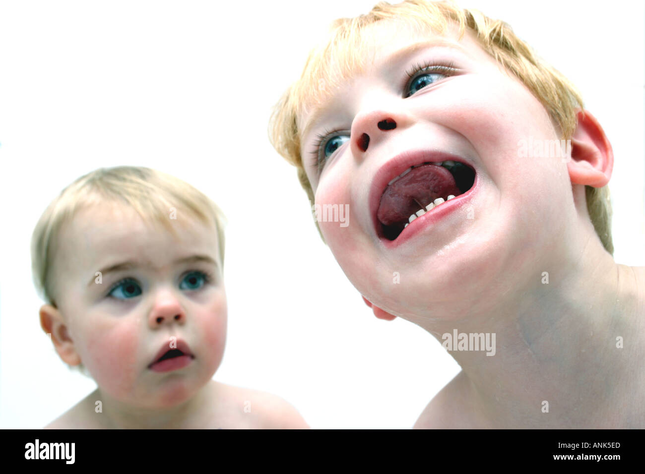 Boy with cheeky grin hi-res stock photography and images - Alamy