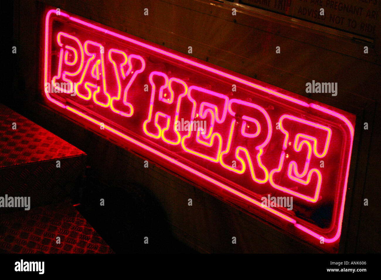 neon pay here sign at showground Stock Photo - Alamy