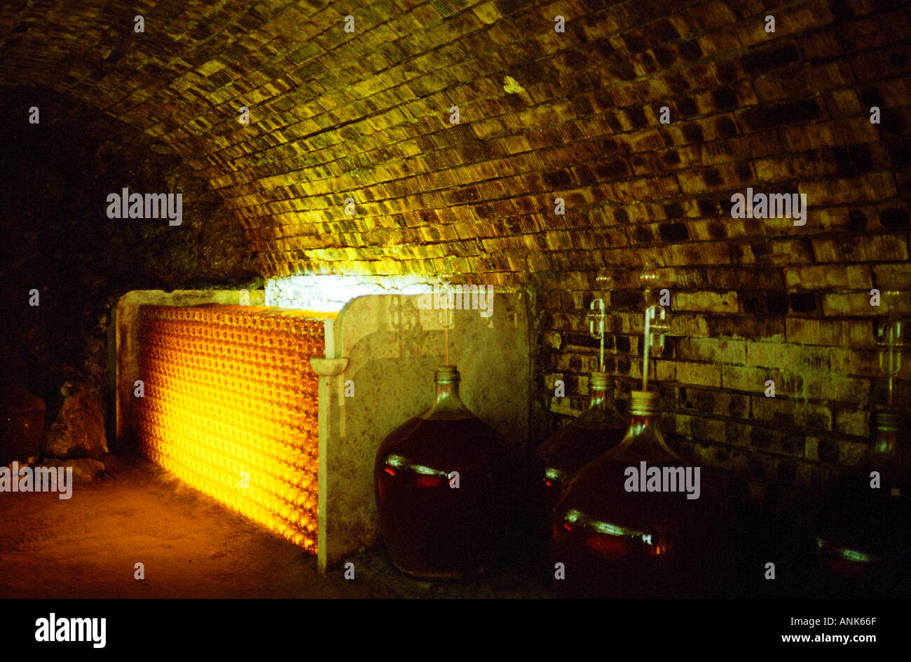 Disznoko winery: bottles of golden Tokaj wine stacked high and ...