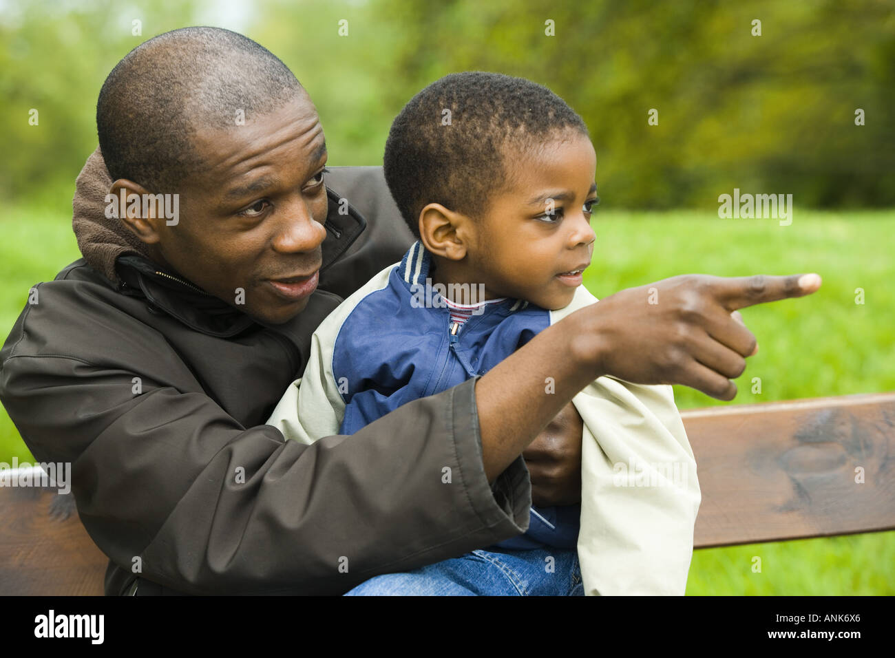 Close up of a father sitting with his son Stock Photo - Alamy