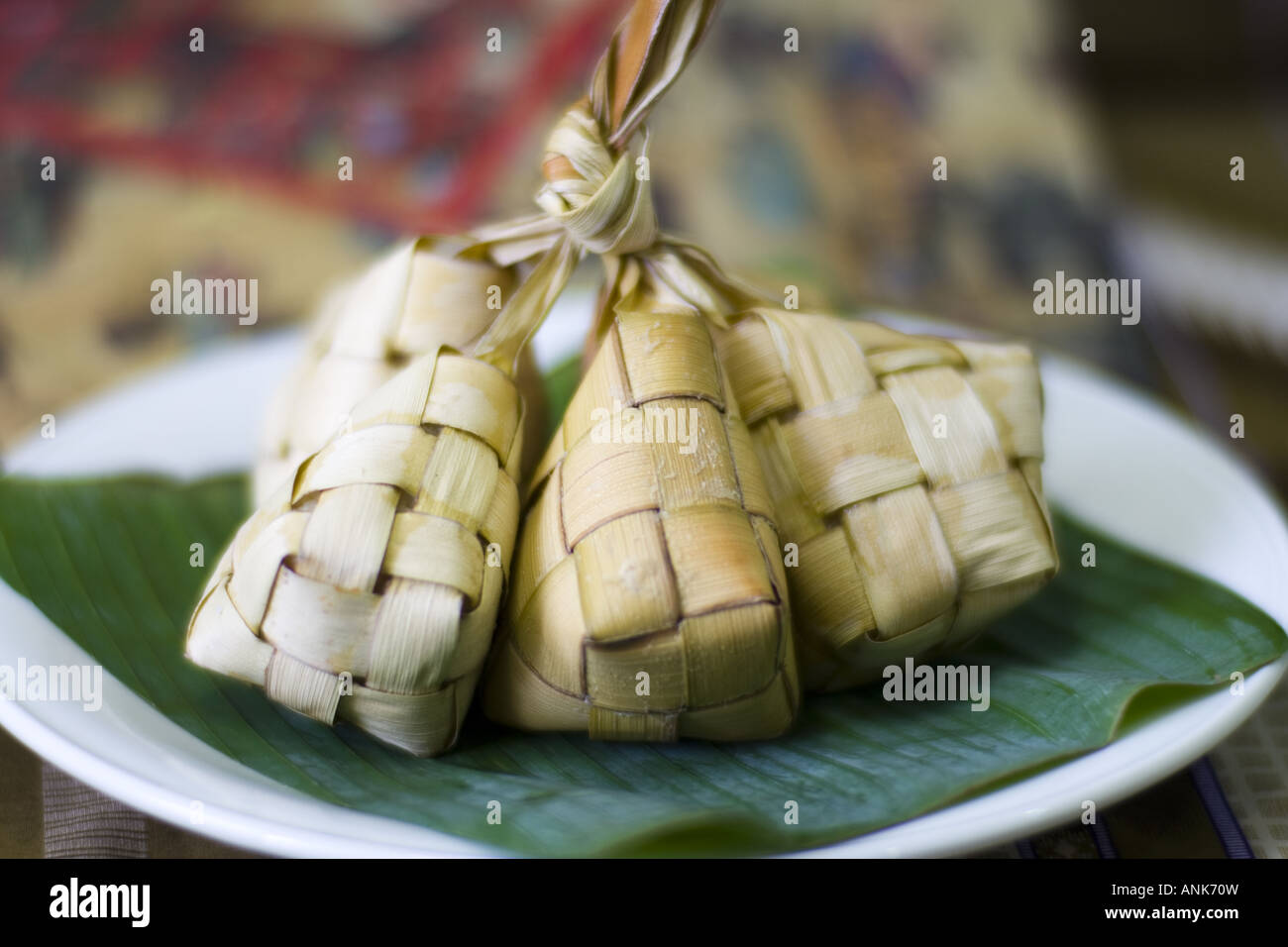 Traditional Malaysian ketupat glutinous rice dumplings wrapped in palm ...