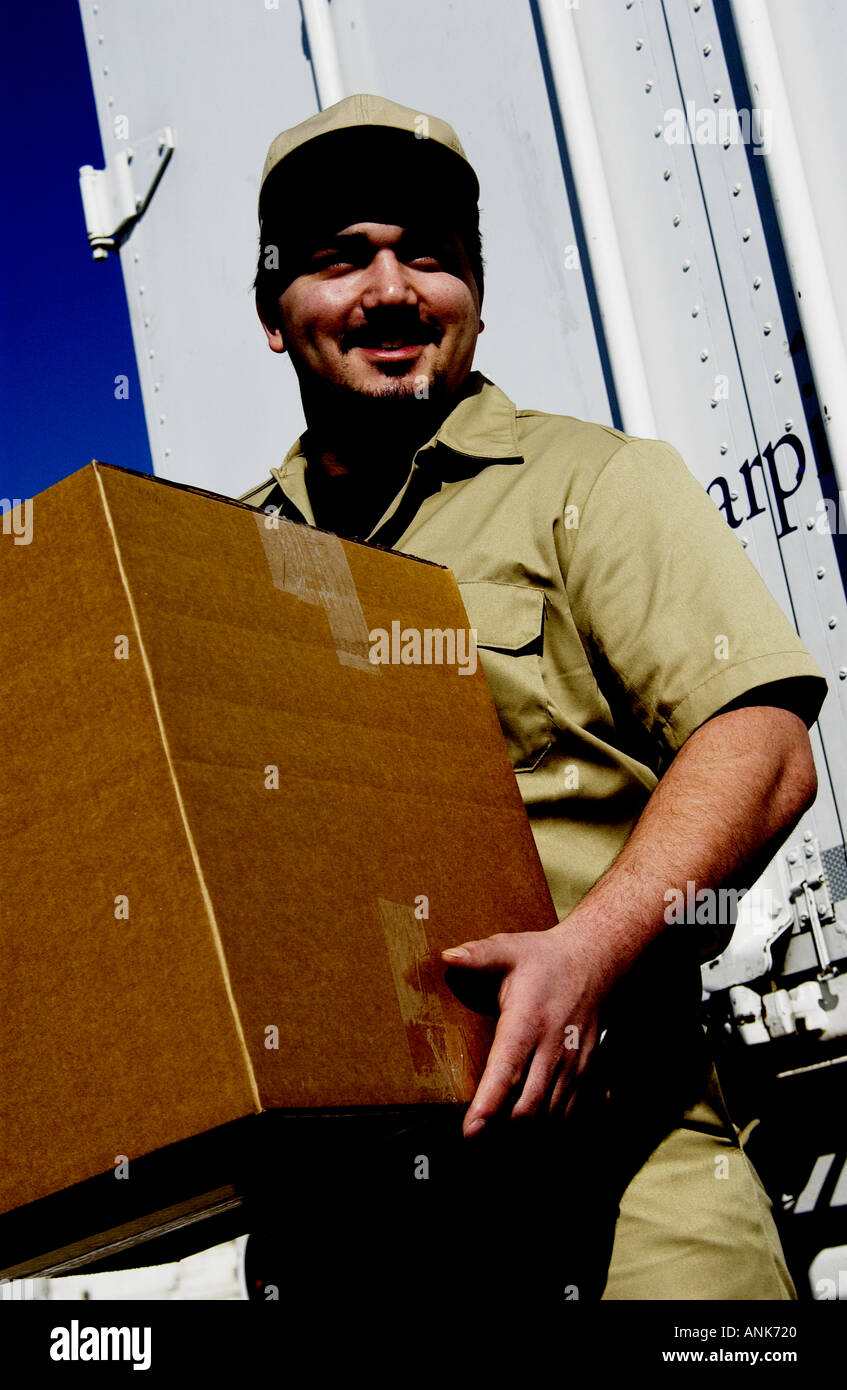 Man delivering packages Stock Photo - Alamy