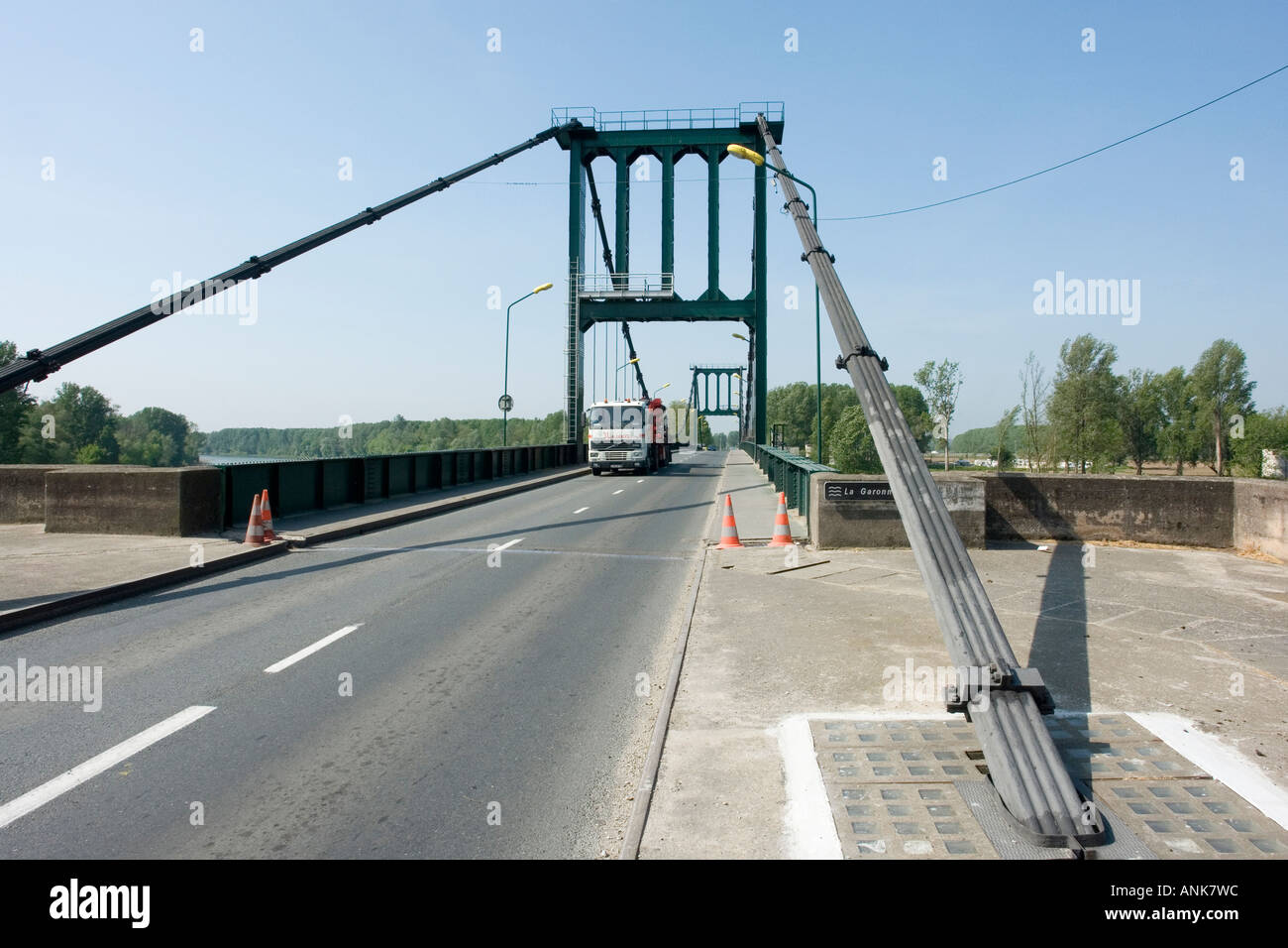 truck crossing the suspension bridge over the river Garonne Marmande ...