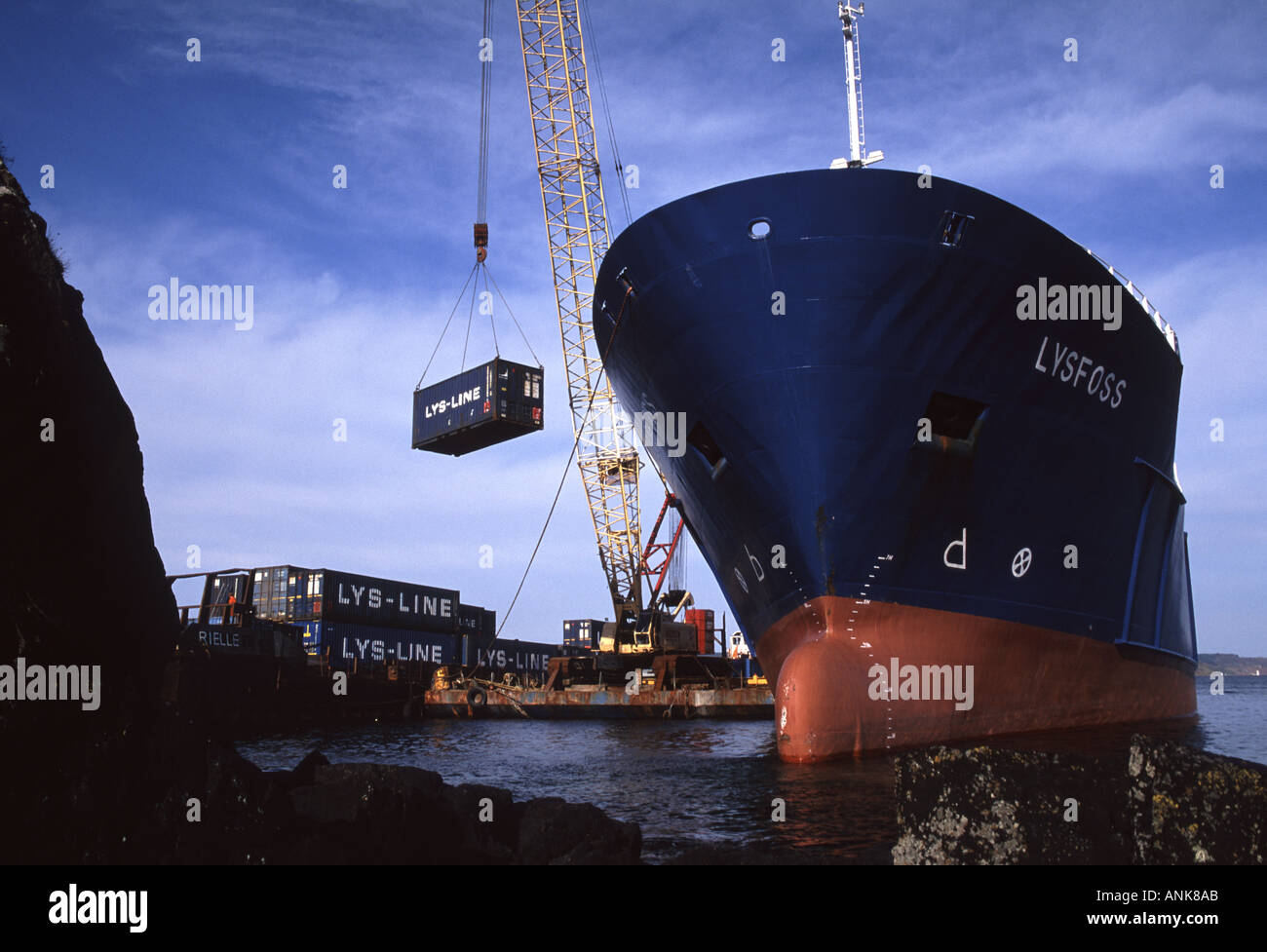 UK Scotland The Sound of Mull Container Ship aground on rocks removing ...