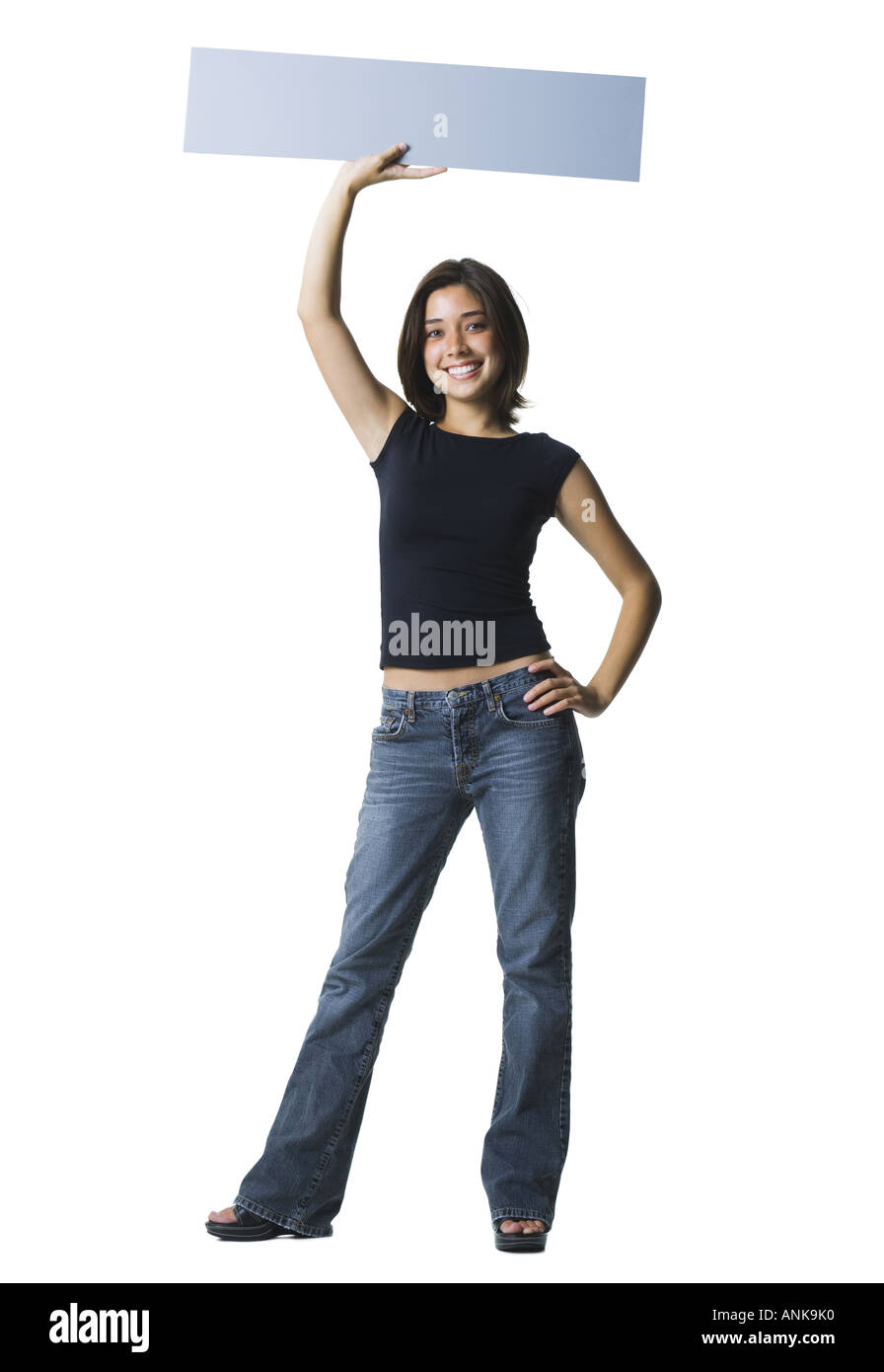 Portrait of a young woman holding up a blank sign Stock Photo - Alamy