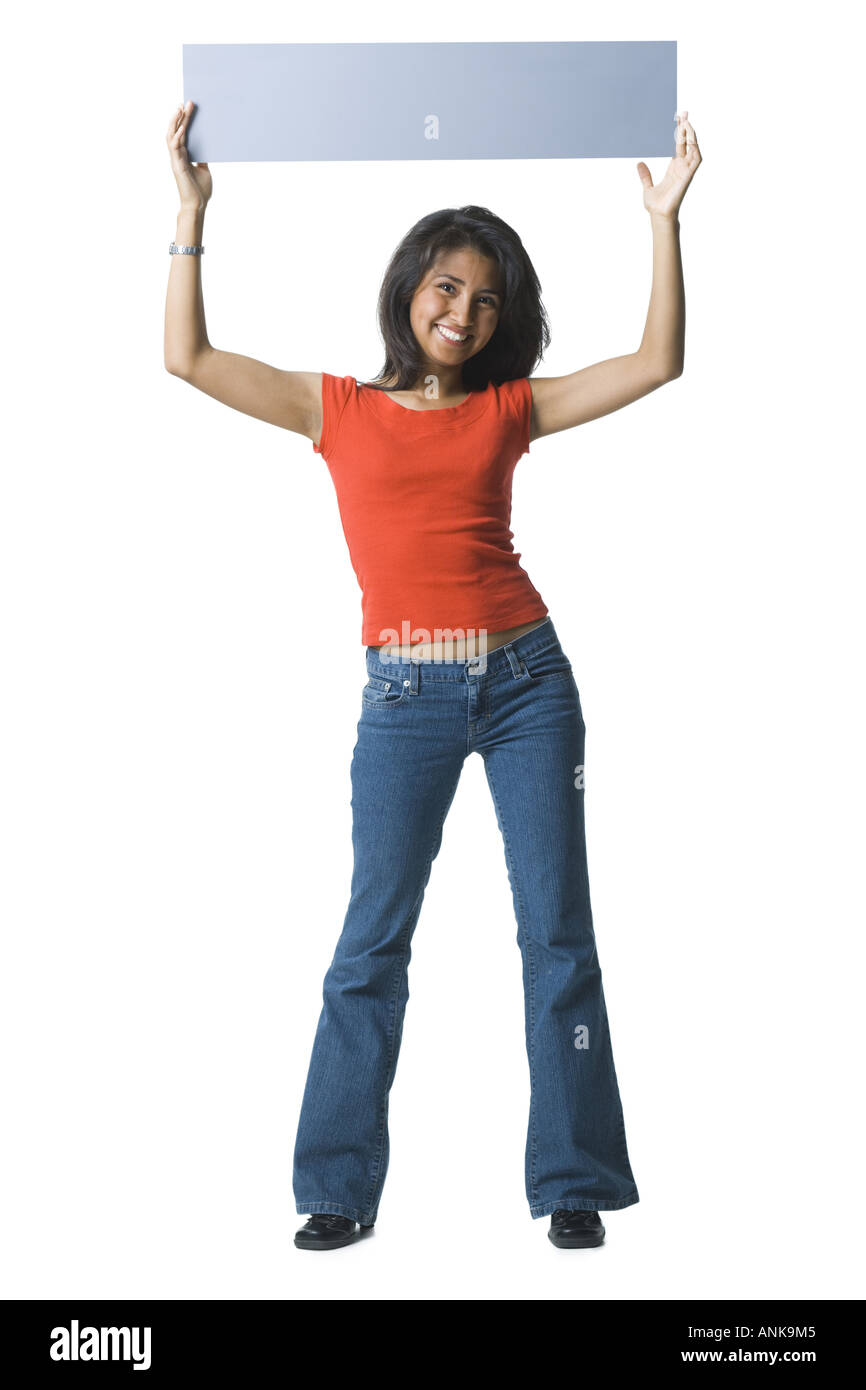 Portrait of a young woman holding up a blank sign Stock Photo - Alamy