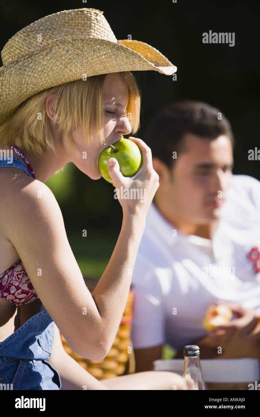 Woman young biting apple profile hi-res stock photography and images ...