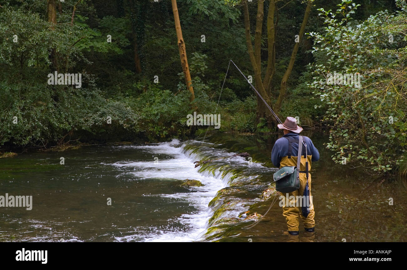 Angler fishing in the River Dove in Dovedale in the Peak District ...