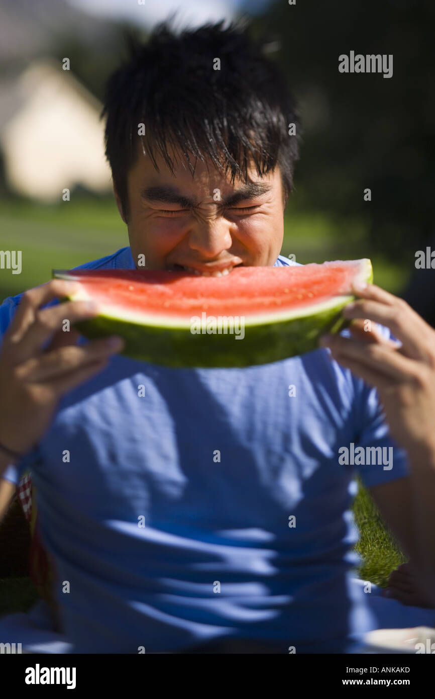 Young black man eating watermelon hi-res stock photography and images ...