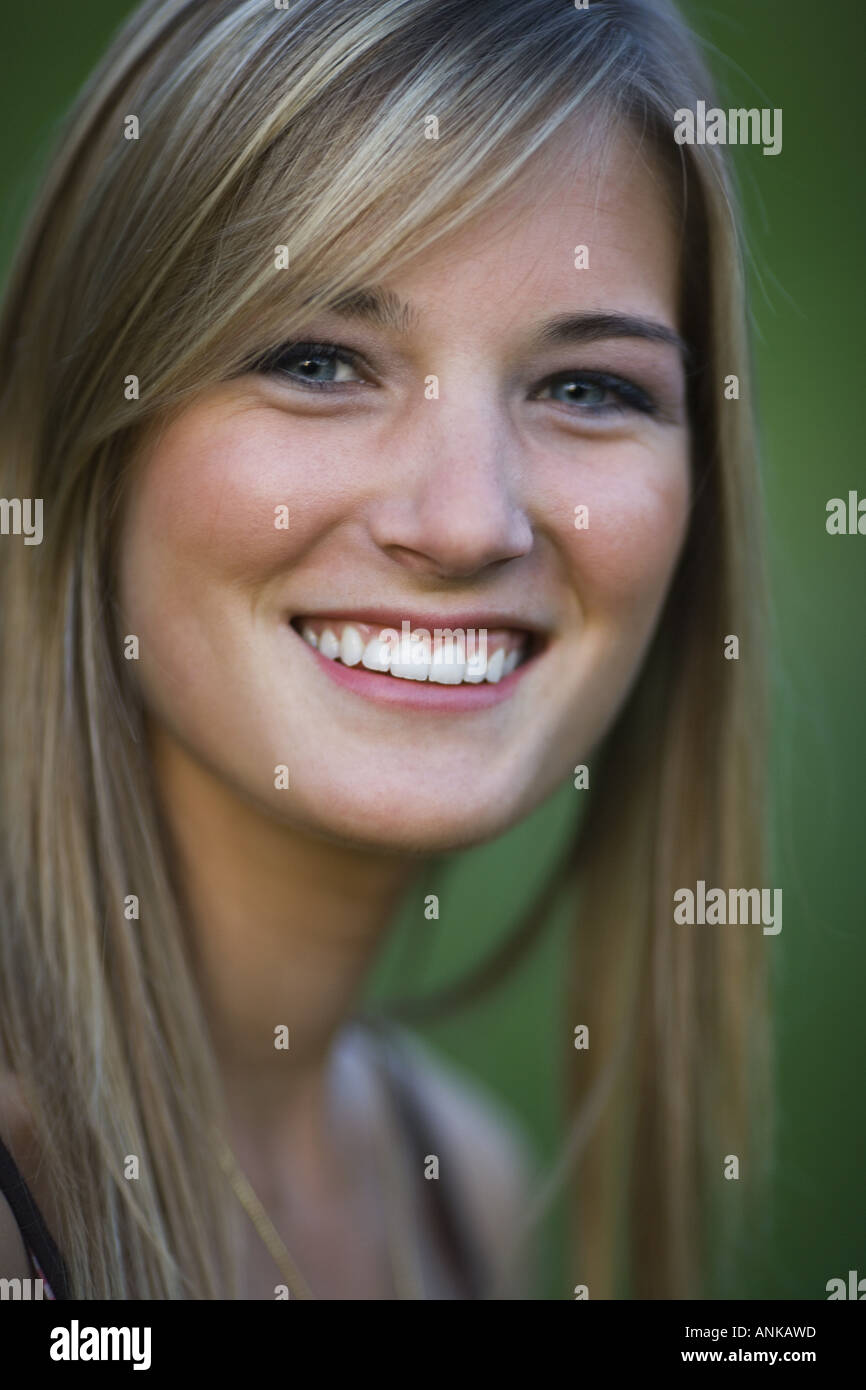 Portrait of a teenage girl smiling Stock Photo - Alamy
