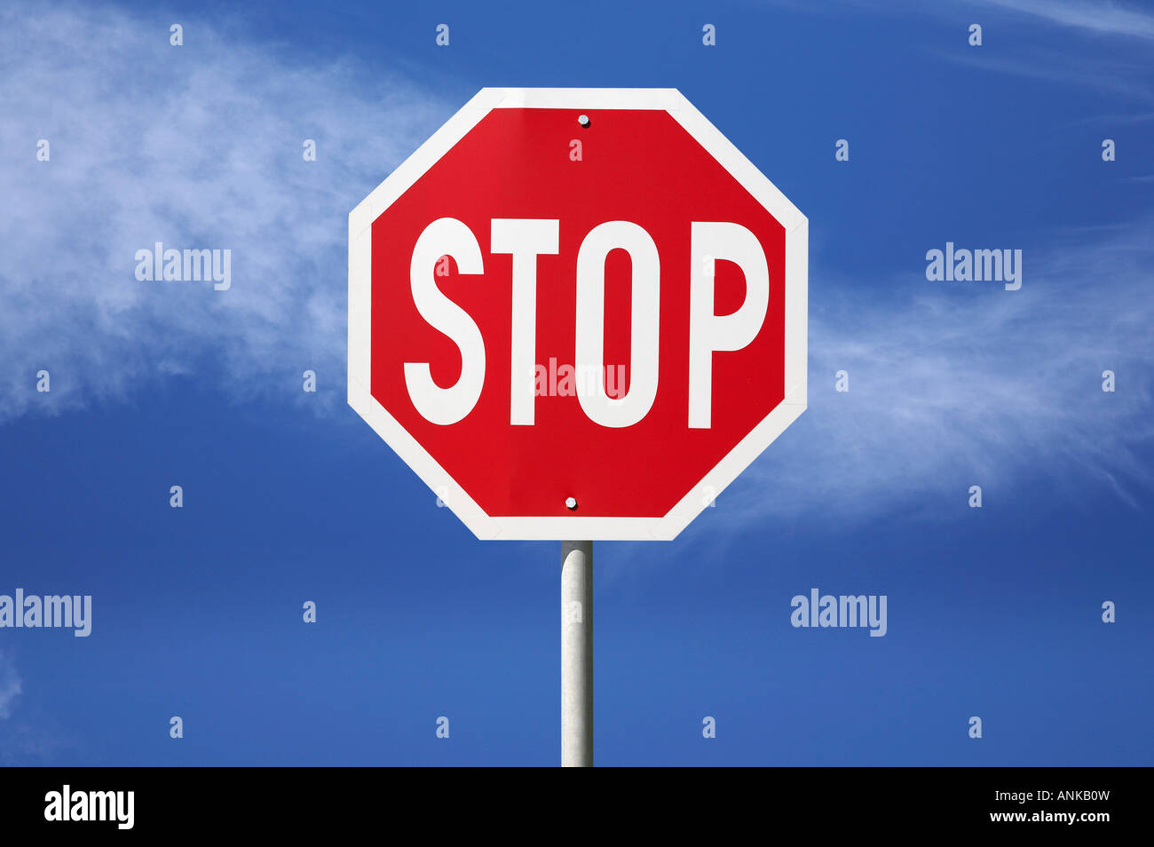 Stop sign and blue sky background Stock Photo - Alamy