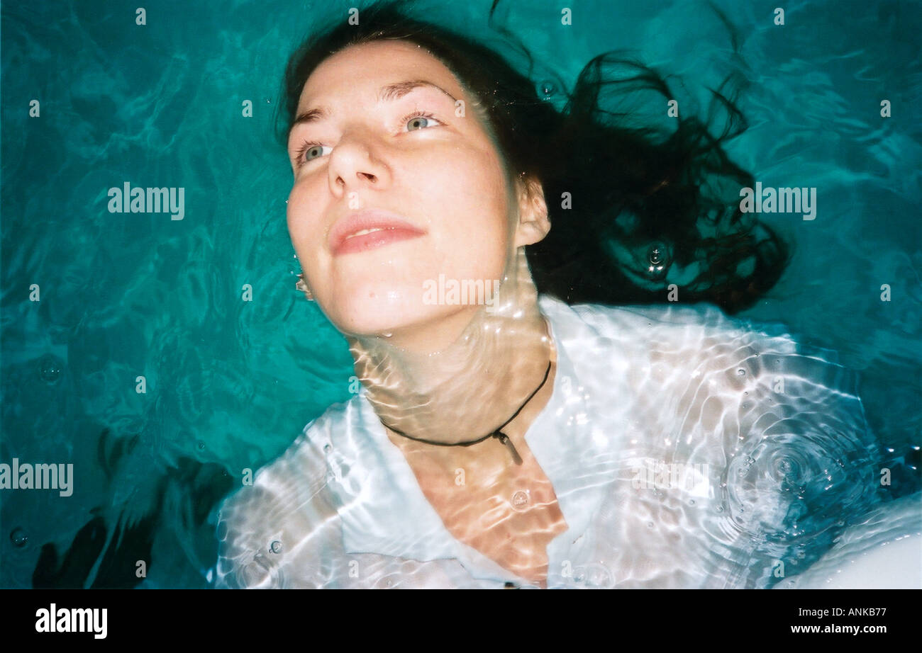 Female in water floating Stock Photo - Alamy