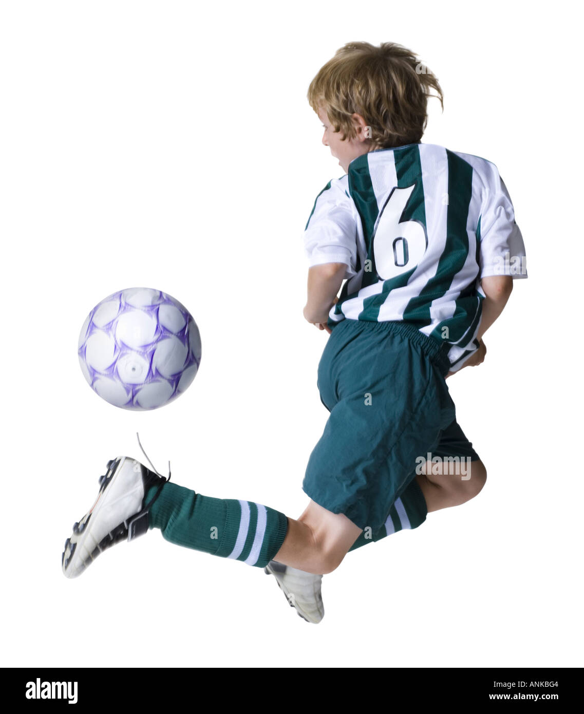 Rear view of a boy playing a soccer ball Stock Photo - Alamy