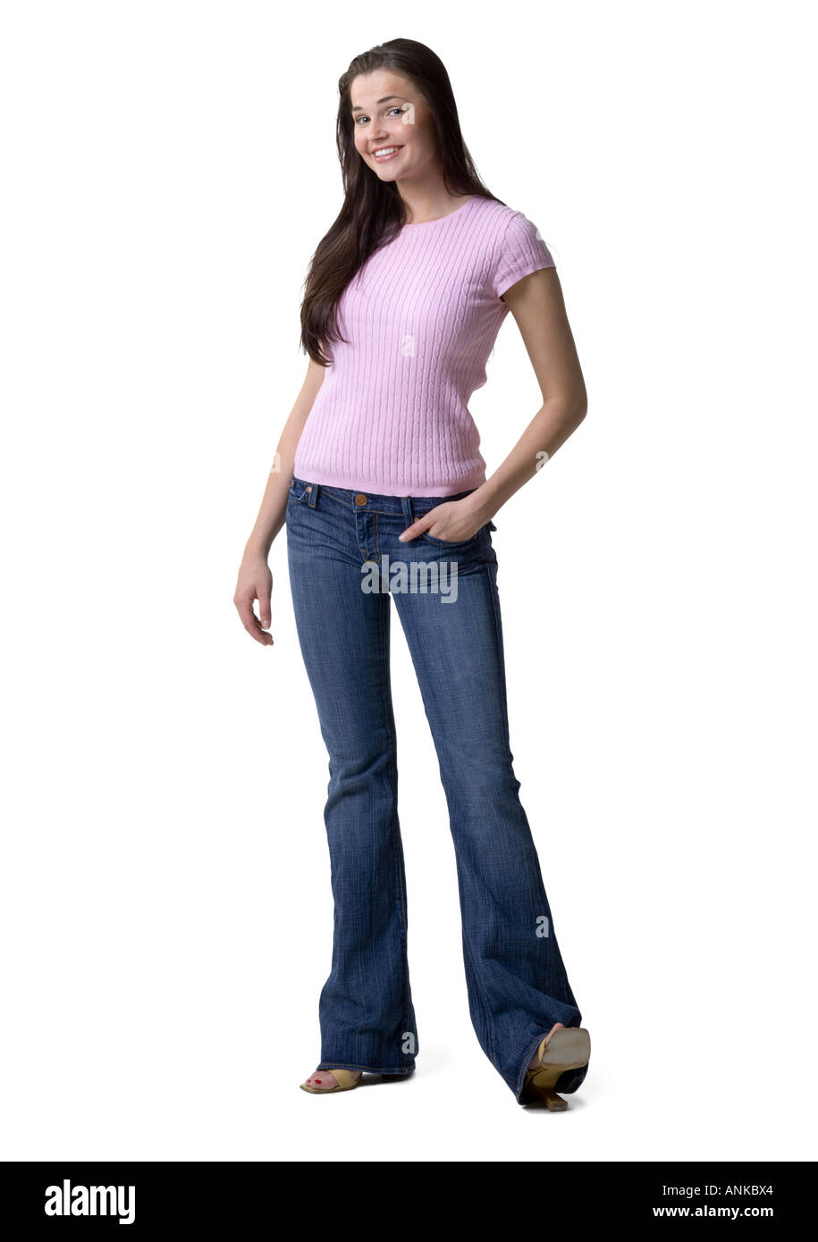 Young woman standing facing camera Stock Photo - Alamy