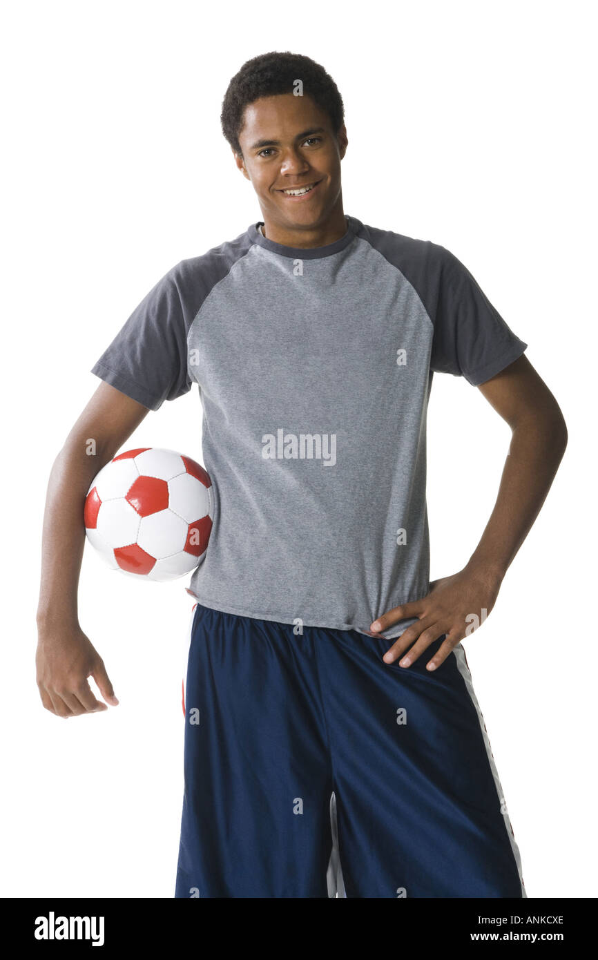 Boy football under arm hi-res stock photography and images - Alamy