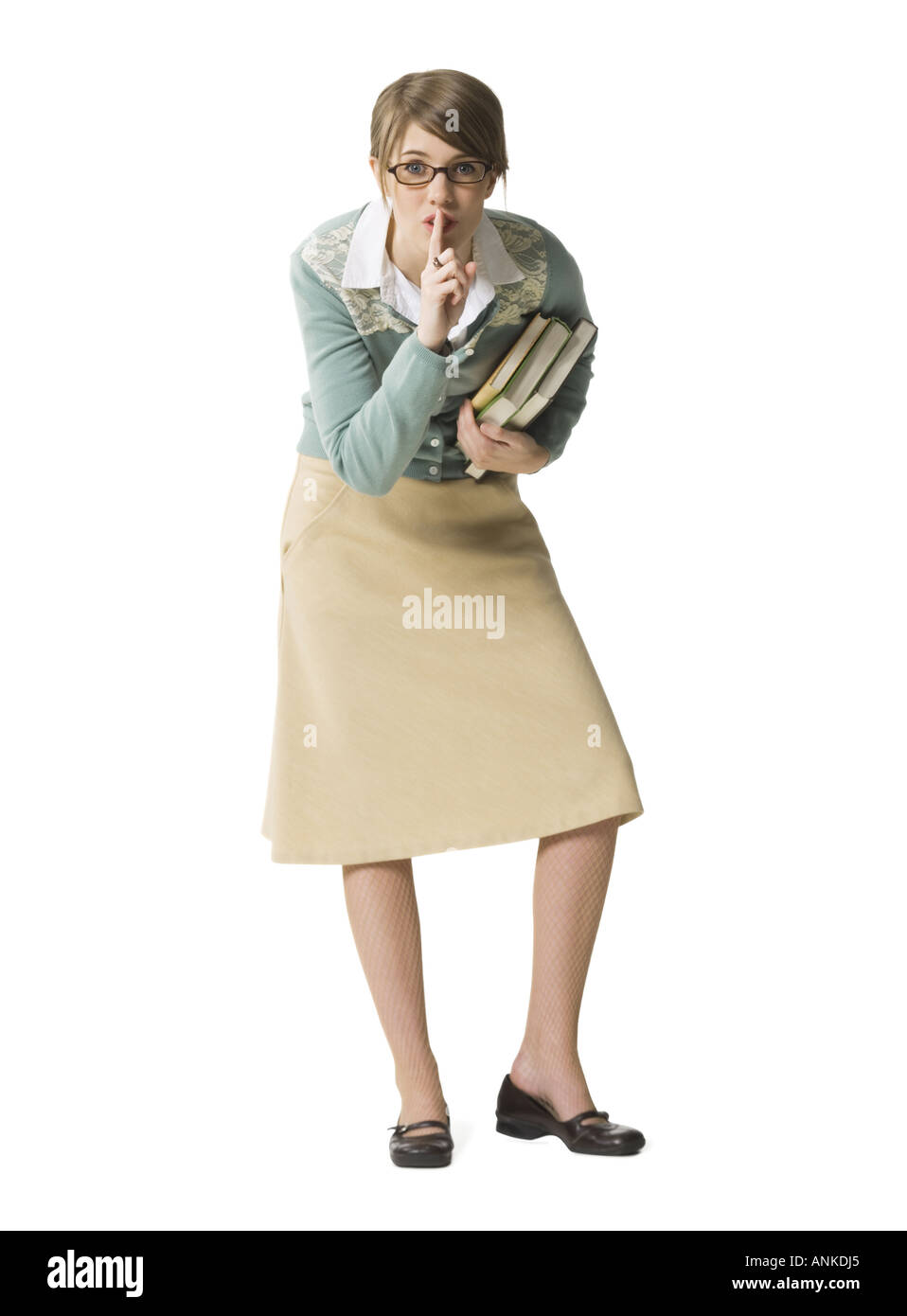 Portrait of a librarian with a finger on her lips Stock Photo - Alamy