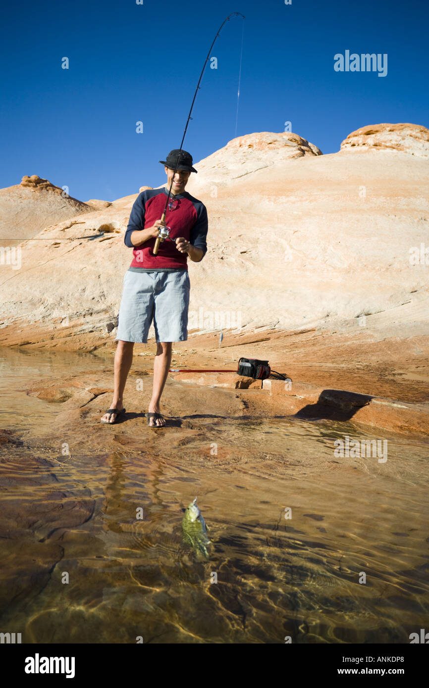 Young man in hat fishing hi-res stock photography and images - Alamy