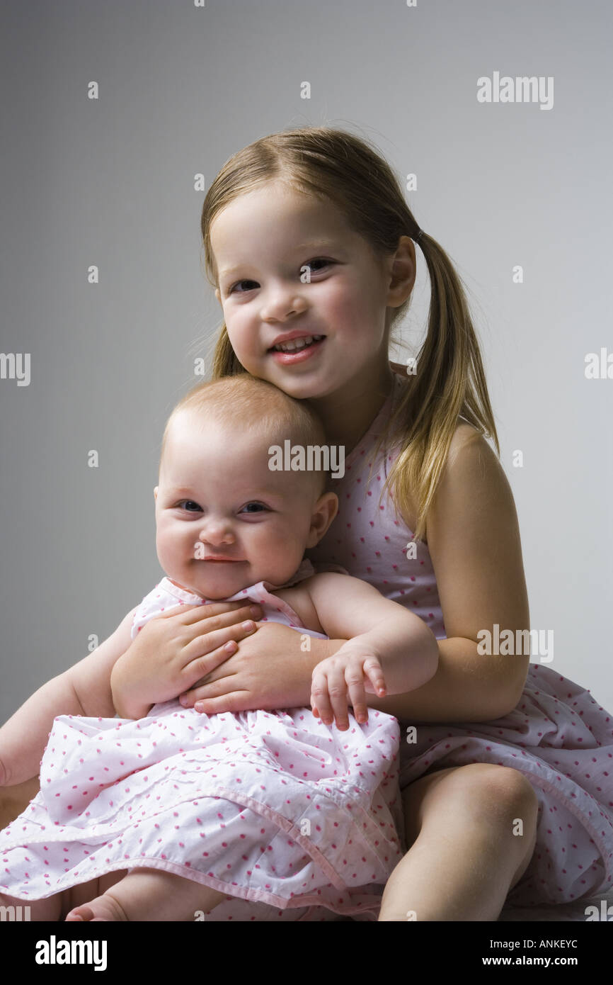 Tween girl holding baby hi-res stock photography and images - Alamy