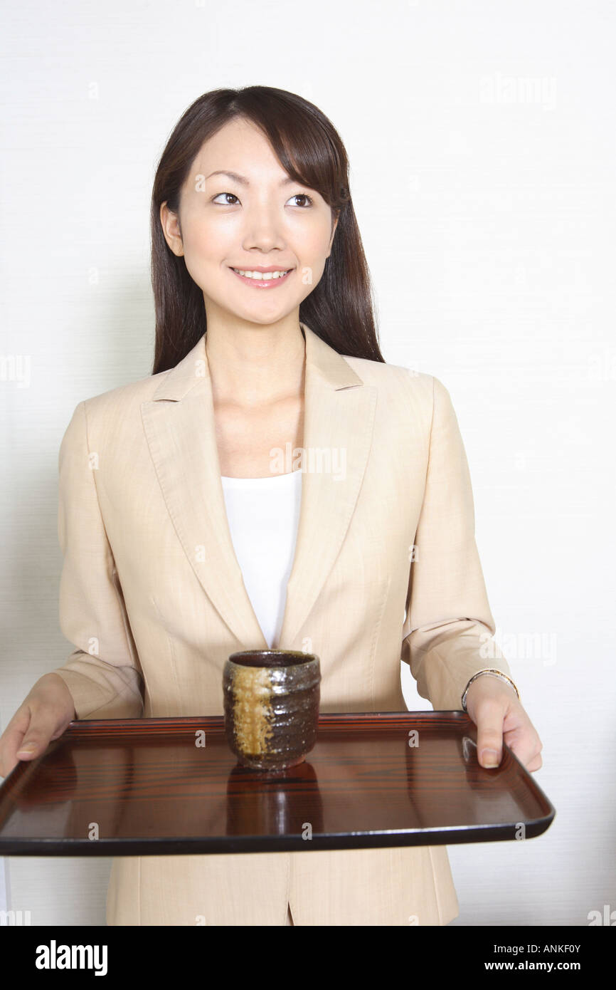 Secretary serving a tea Stock Photo - Alamy