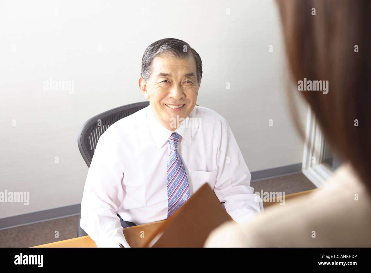Smiling Japanese chief executive officer Stock Photo - Alamy