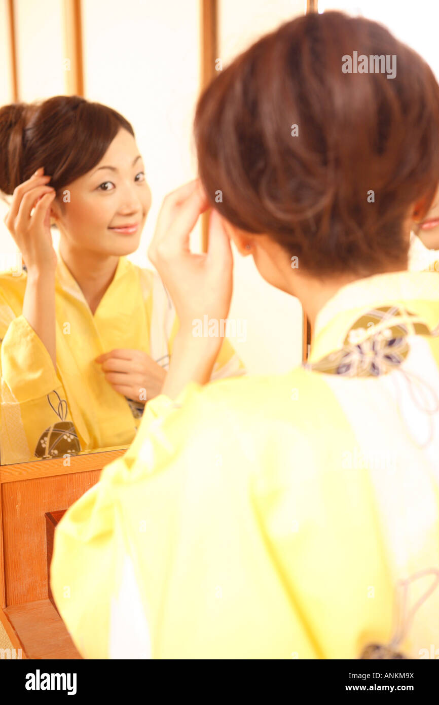 Japanese woman setting hair Stock Photo - Alamy