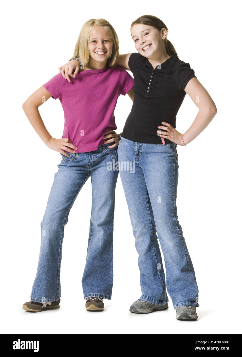 Two young girls standing together Stock Photo - Alamy