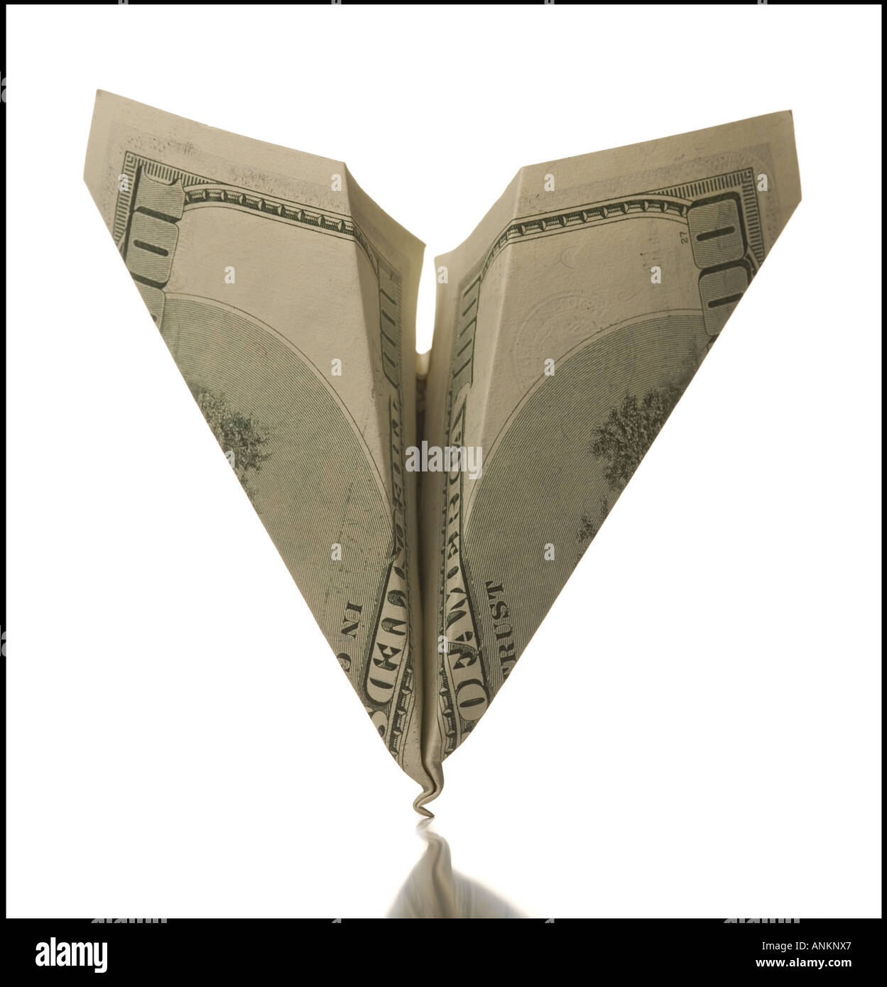 Close up of a paper airplane made from one hundred dollar bill with ...