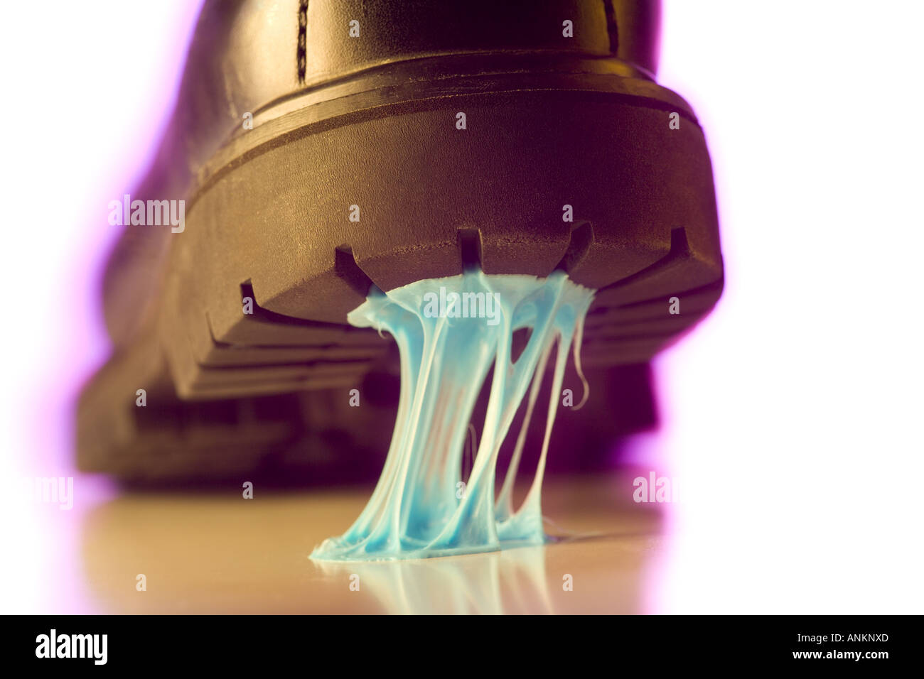 Close up of gum stuck to a leather shoe Stock Photo - Alamy
