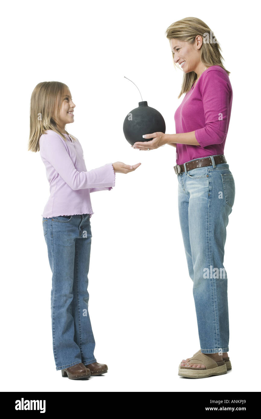 Profile of a mother giving a bomb to her daughter Stock Photo - Alamy