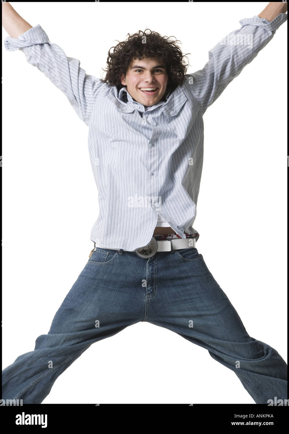 Portrait of a teenage boy jumping in mid air Stock Photo - Alamy