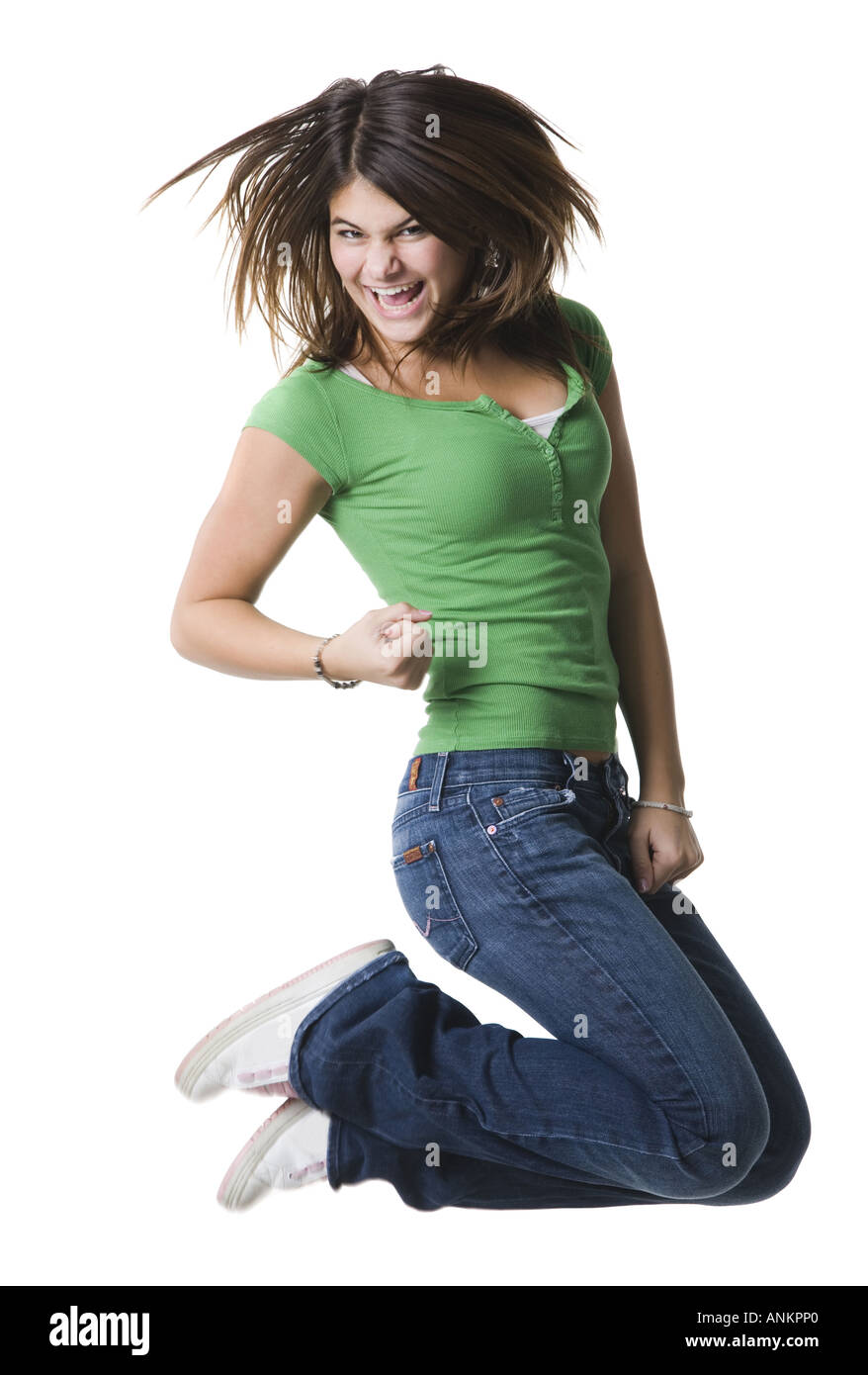 Portrait of a teenage girl jumping in mid air Stock Photo - Alamy