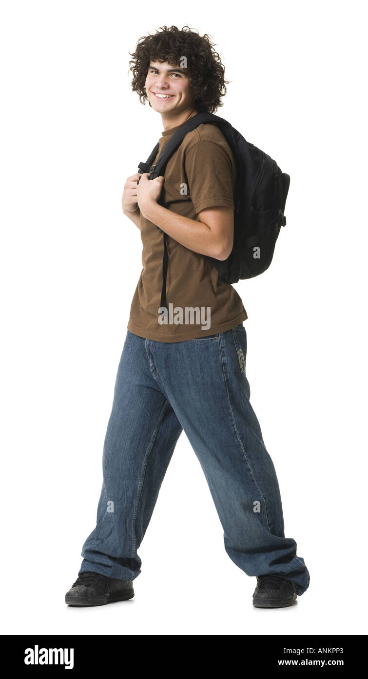 Portrait of a teenage boy carrying a bag and smiling Stock Photo - Alamy