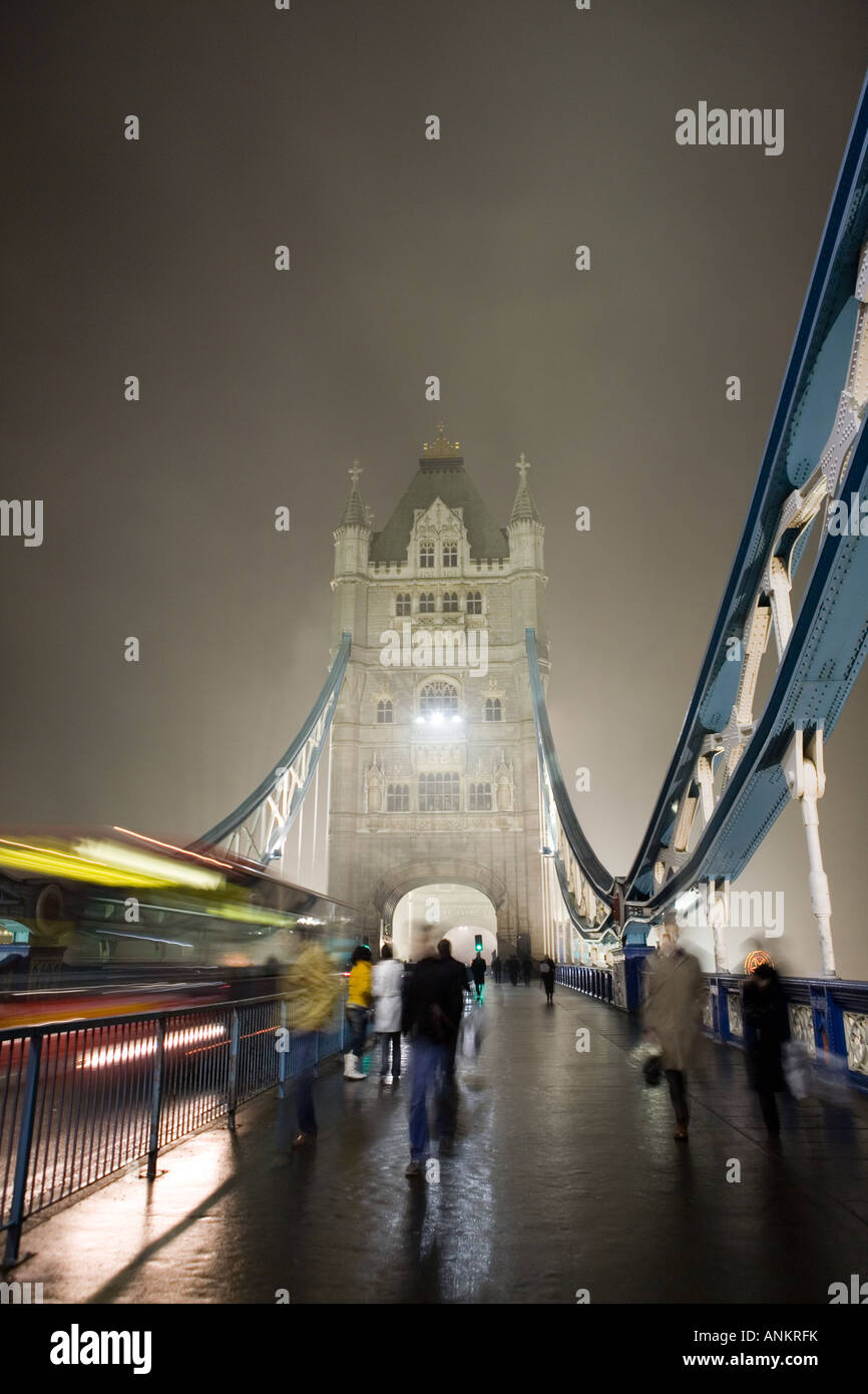 People and traffic cross Tower Bridge in London, England Stock Photo ...