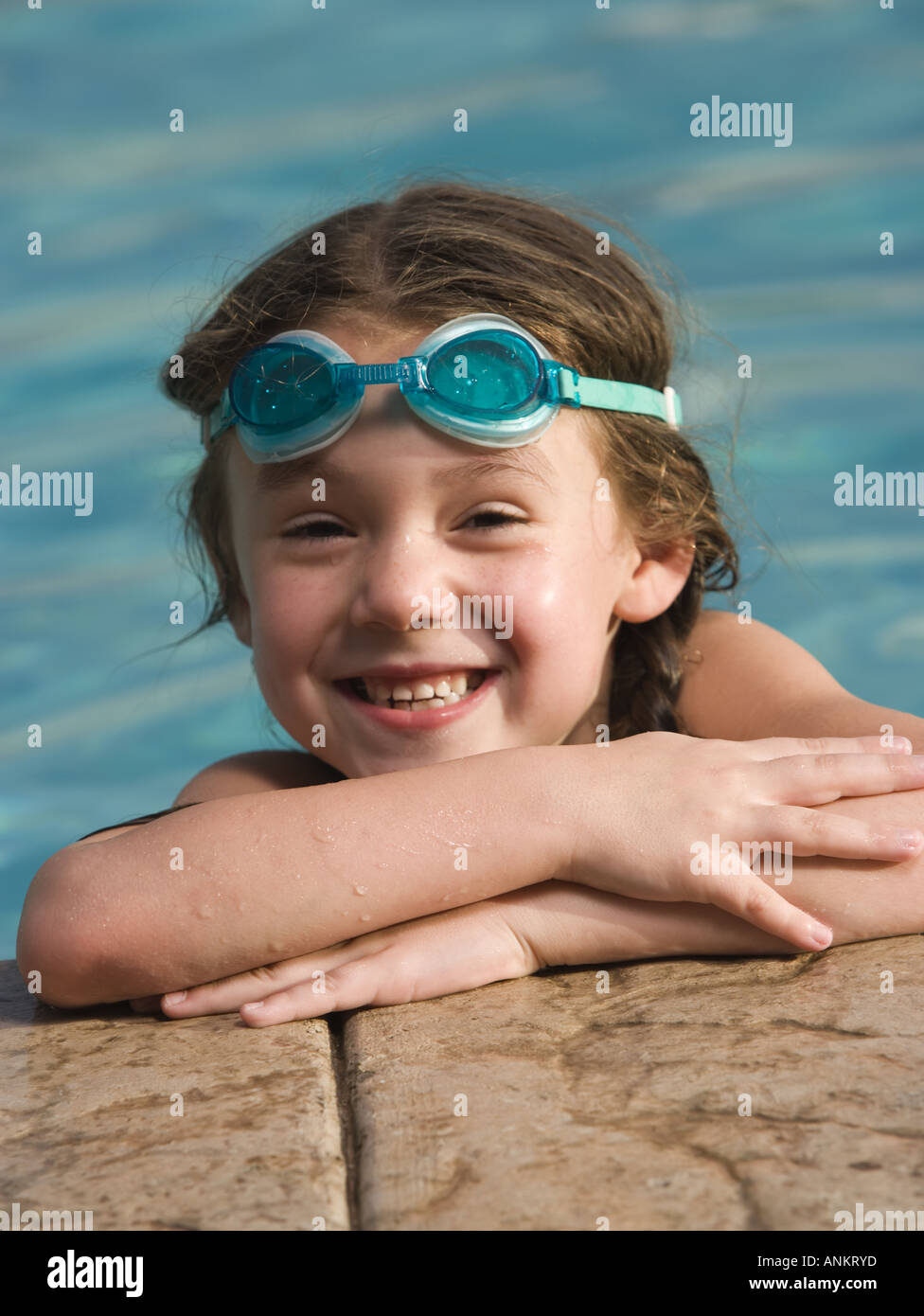 Portrait of a girl smiling at the pool Stock Photo - Alamy